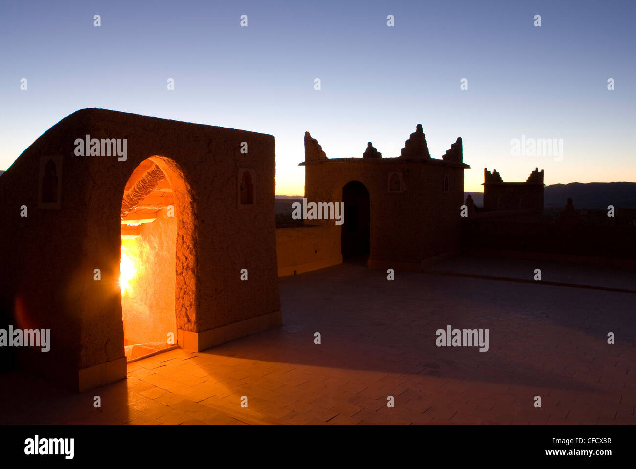 Roof terrace at dawn on a kasbah in the town of Nkob, with light ...