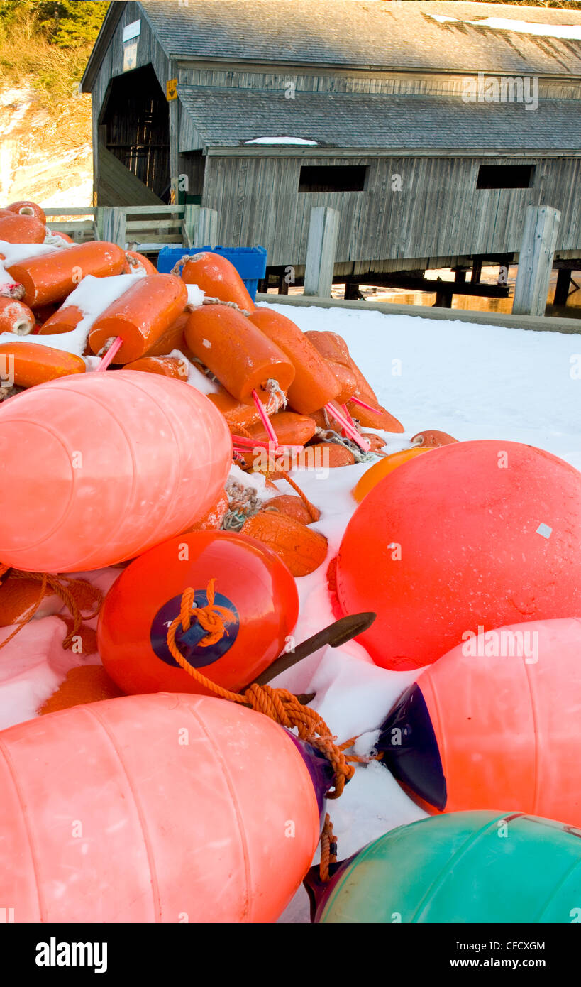 Fishing buoys in front of Covered bridge, St. Martin's, Bay of Fundy ...