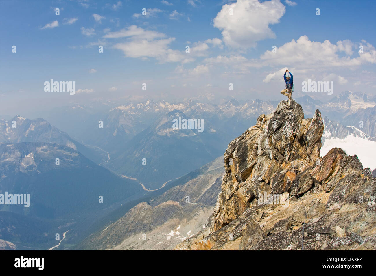 Young man mountain climbing the classic north west ridge of Mt. Sir ...