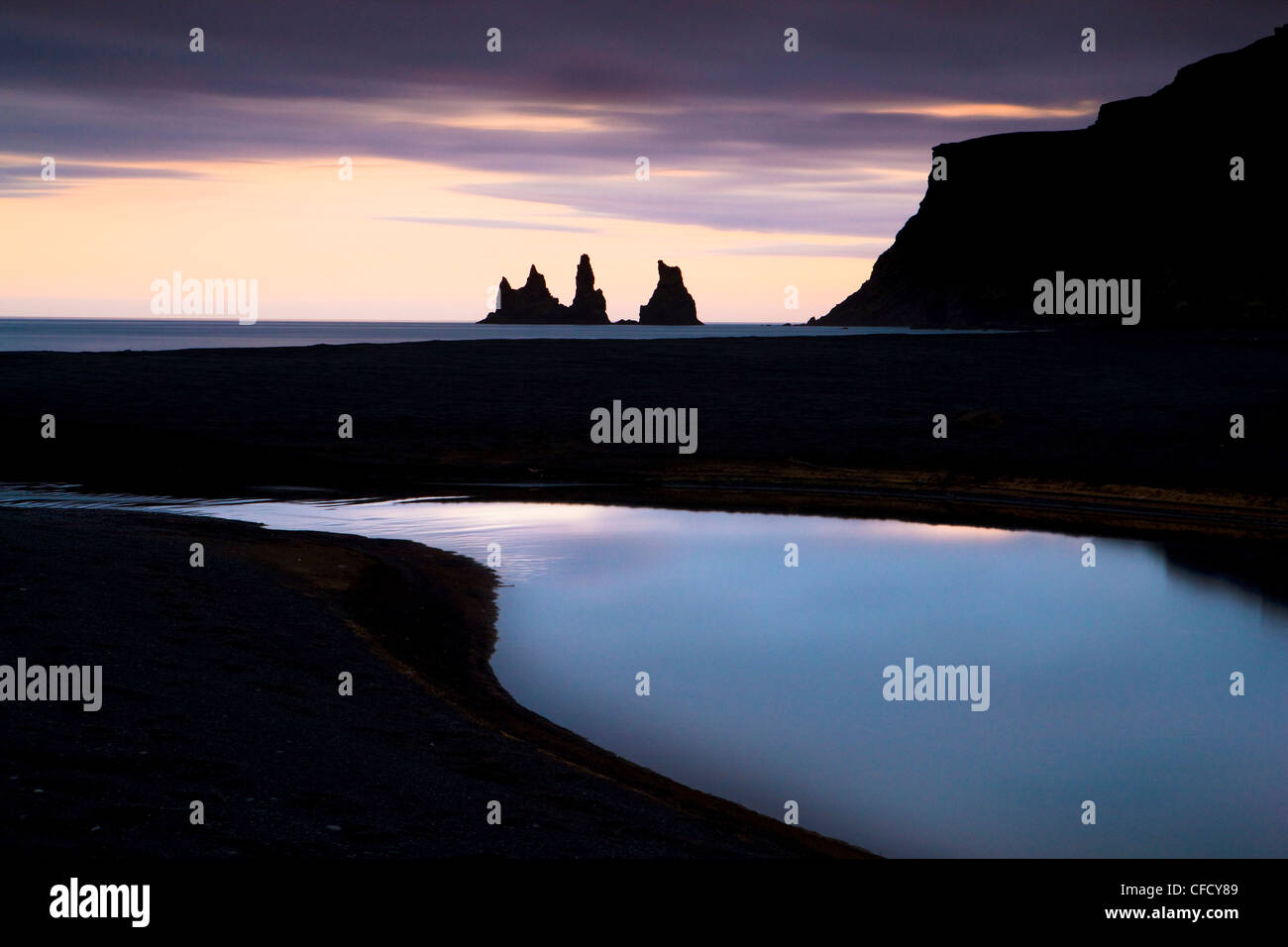 Twilight view towards rock stacks at Reynisdrangar off the coast at Vik ...