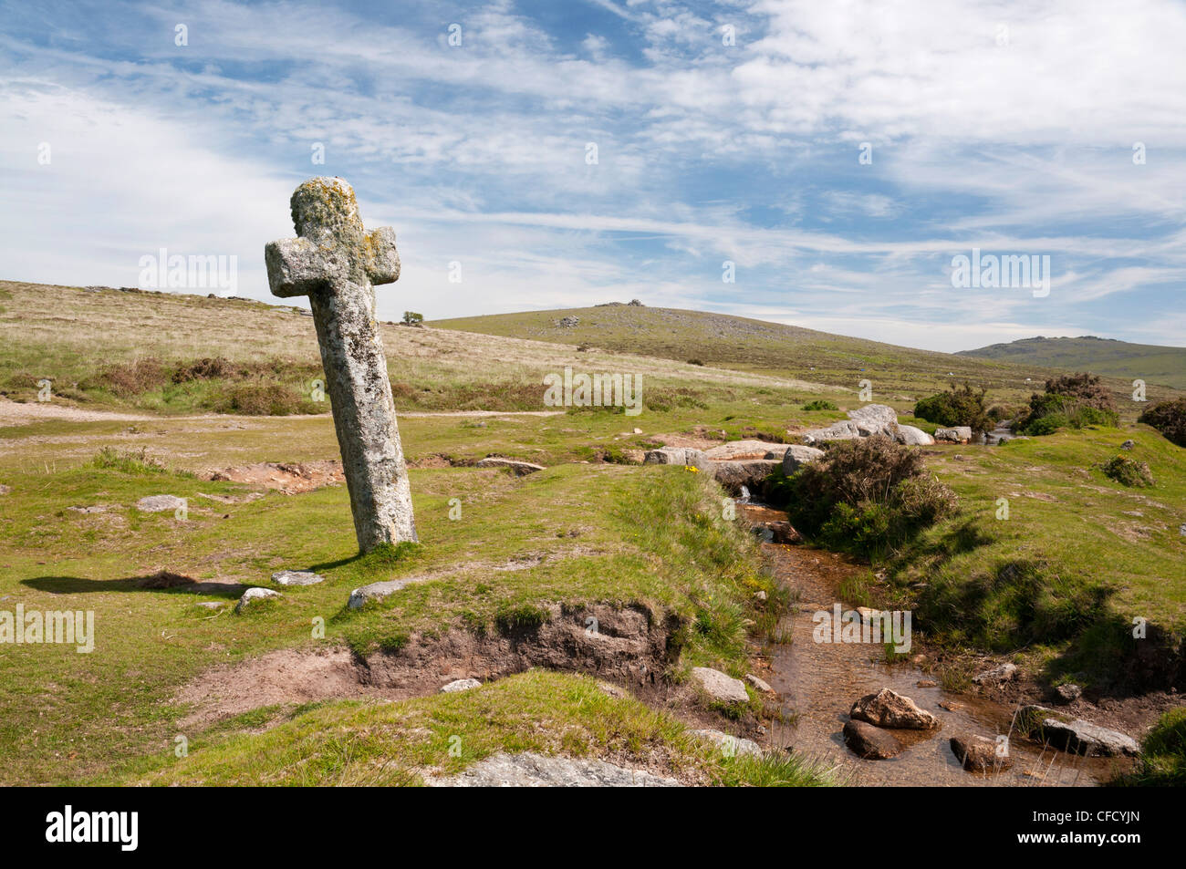 Ancient granite cross known as Windy Post next to leat on Dartmoor ...