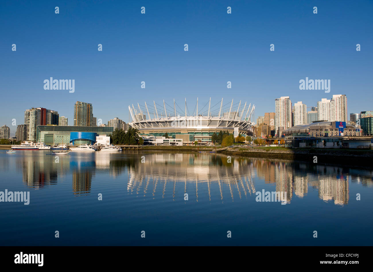 City skyline with new retractable roof on BC Place Stadium, False Creek ...