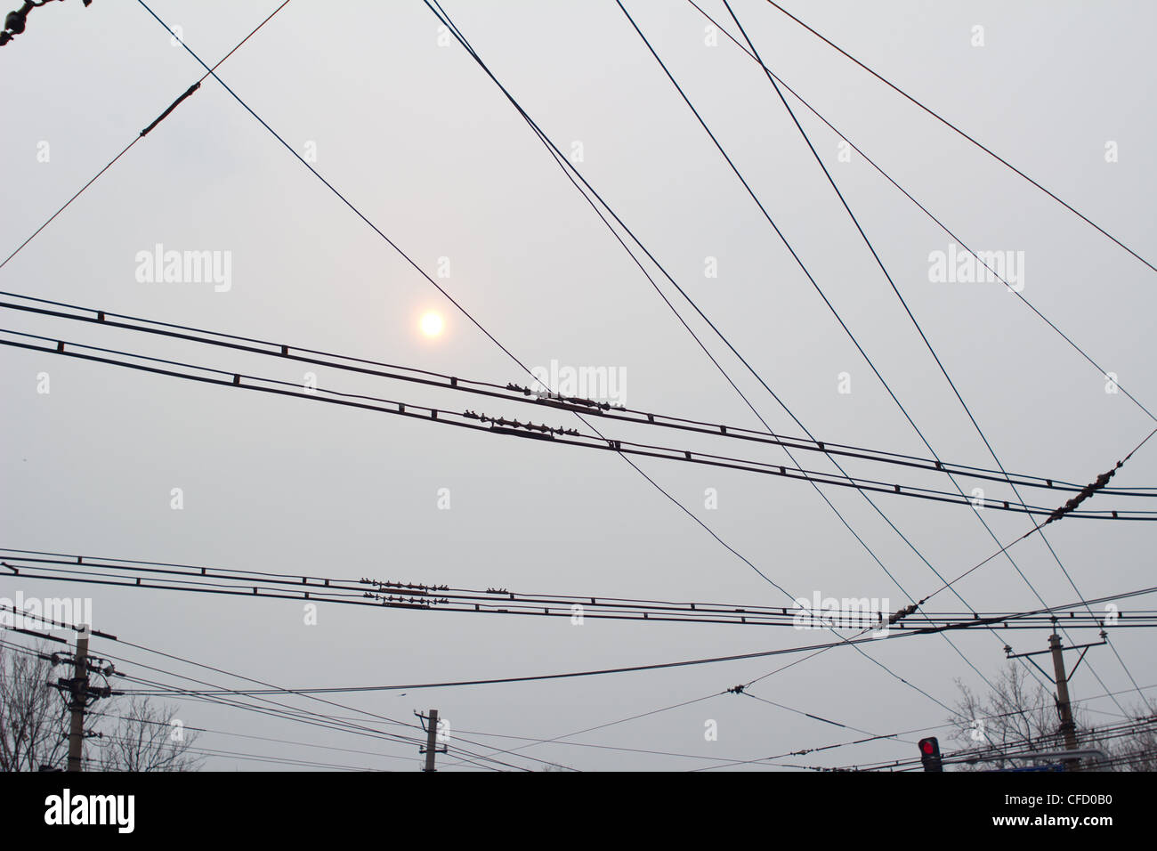 sun and wires in cloudy day Stock Photo - Alamy