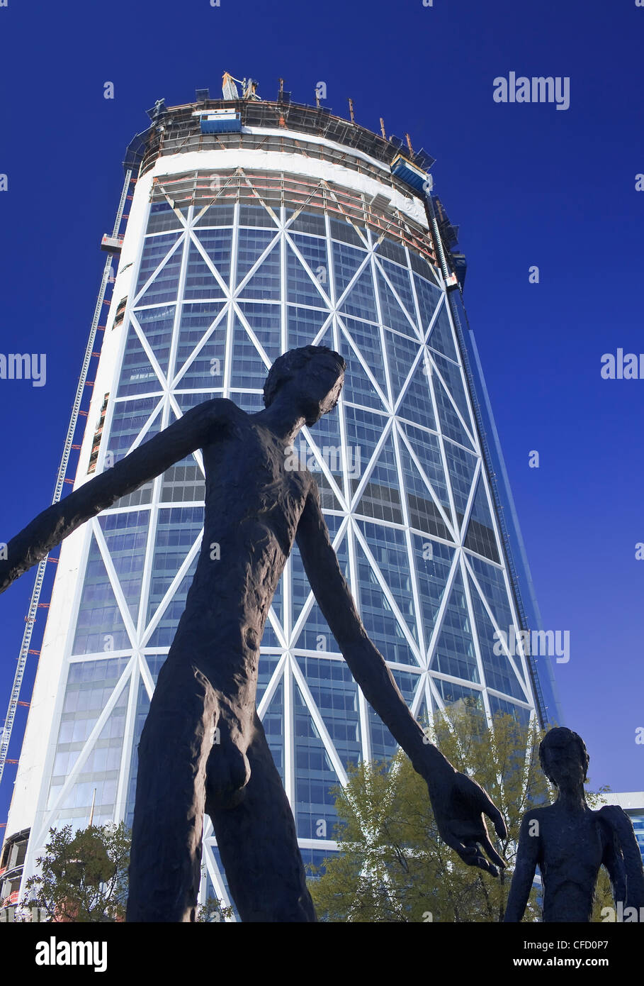 The Family of Man sculpture, and The Bow office tower under ...