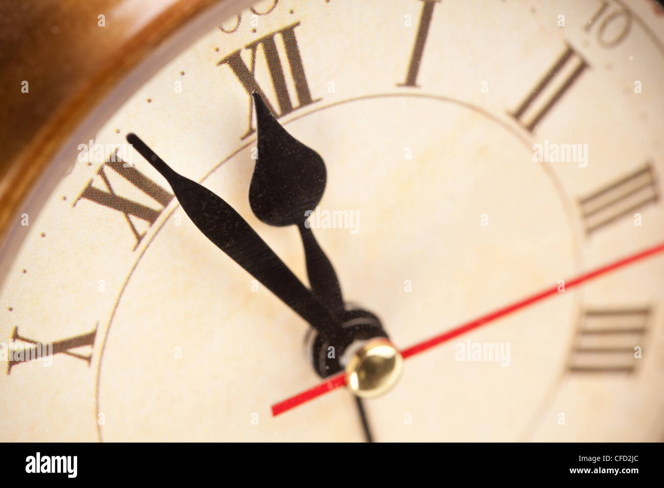 Alarm clock. It's five minutes to twelve p.m. Close up shot Stock Photo ... Alarm clock. It's five minutes to twelve p.m. Close up shot Stock Photo ...