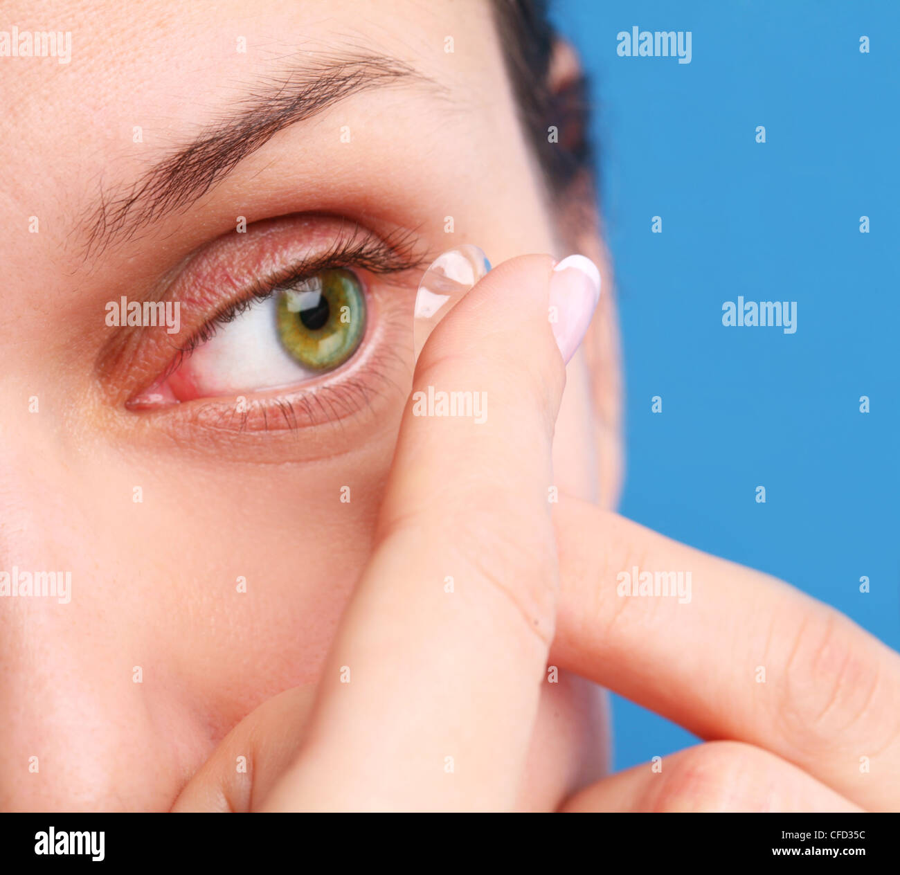 human eye with corrective lens on a blue background Stock Photo - Alamy