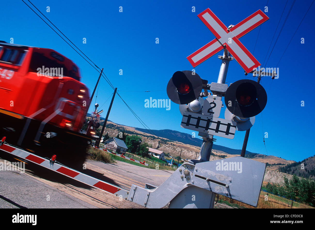Level crossing and locomotive engine, Chase, British Columbia, Canada ...