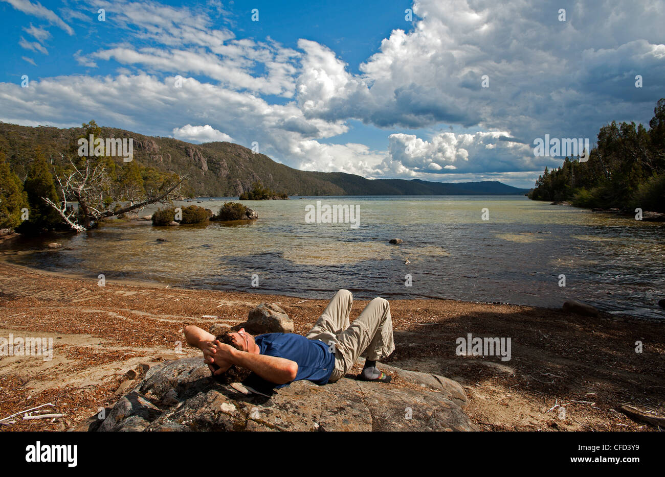 Trekker is relaxing at Lake Meston, Walls of Jerusalem National Park ...