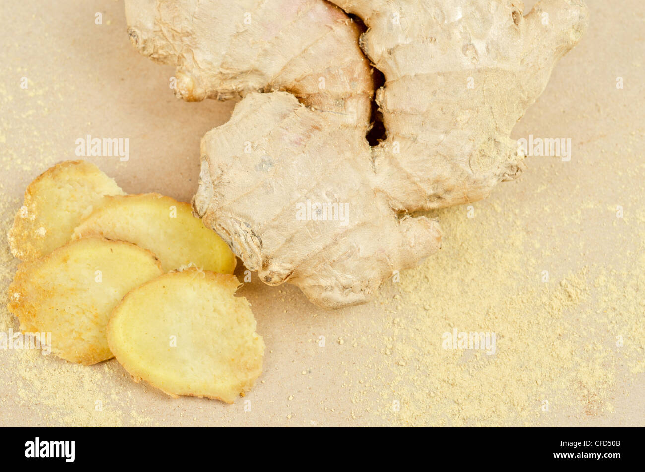 Fresh, dried and powdered ginger at brown background Stock Photo - Alamy
