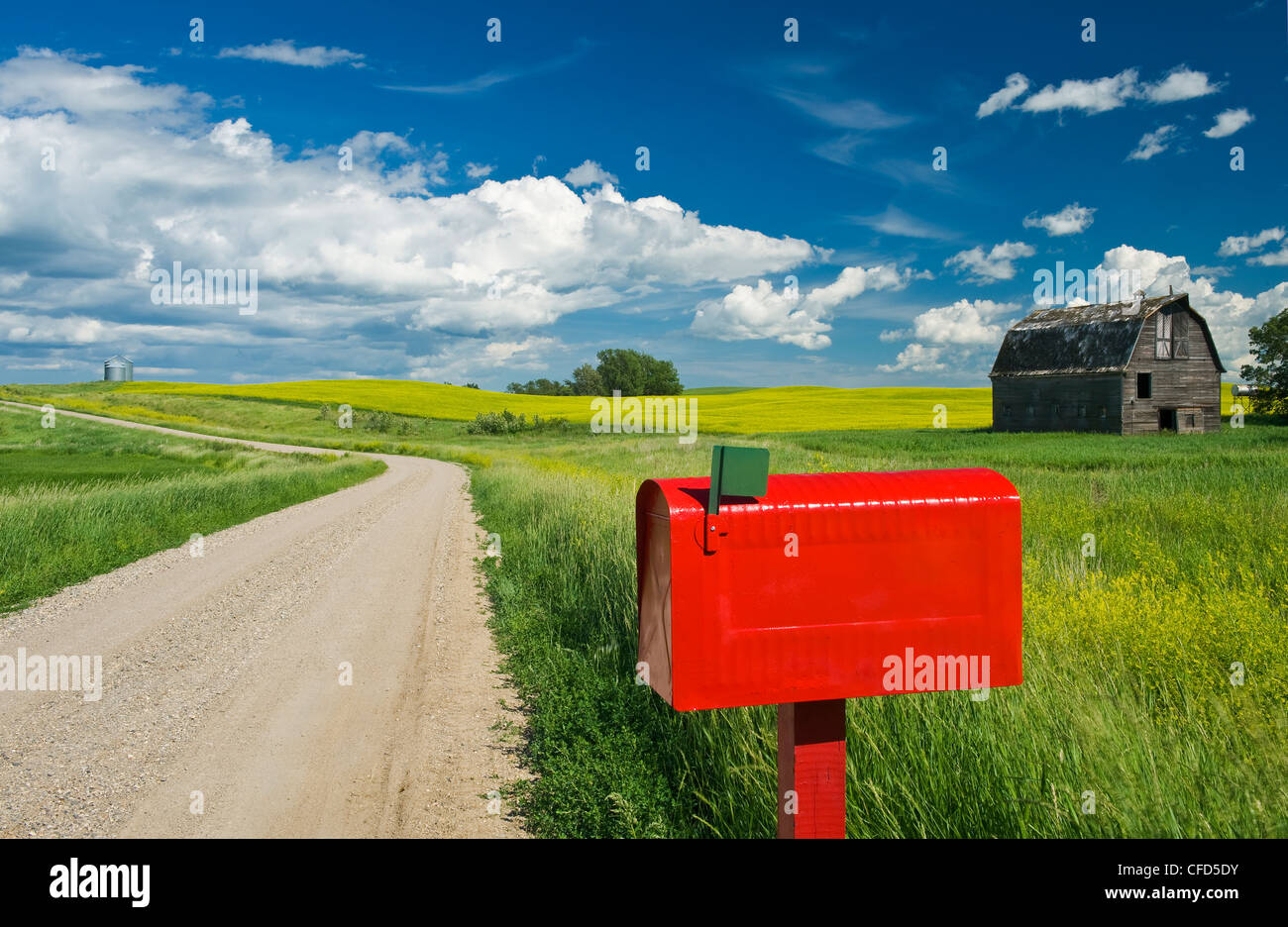 Mailbox along country road with old barn in the background, near ...
