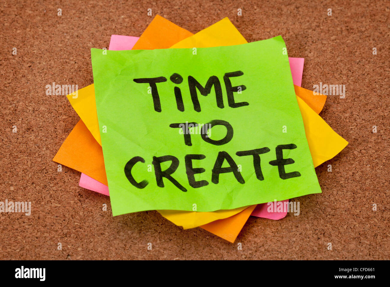creativity concept - time to create reminder on a stack of sticky notes ...