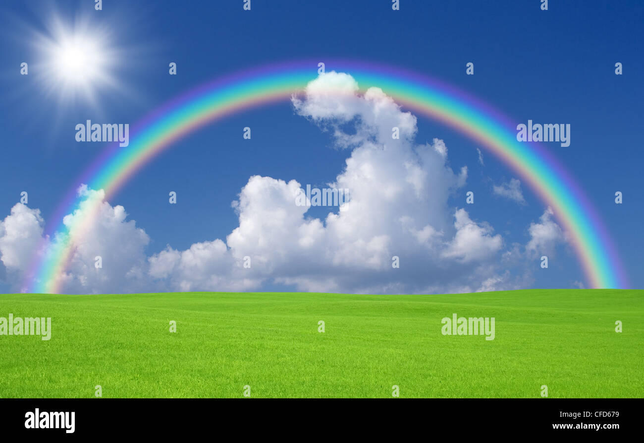 Green field and rainbow Stock Photo - Alamy