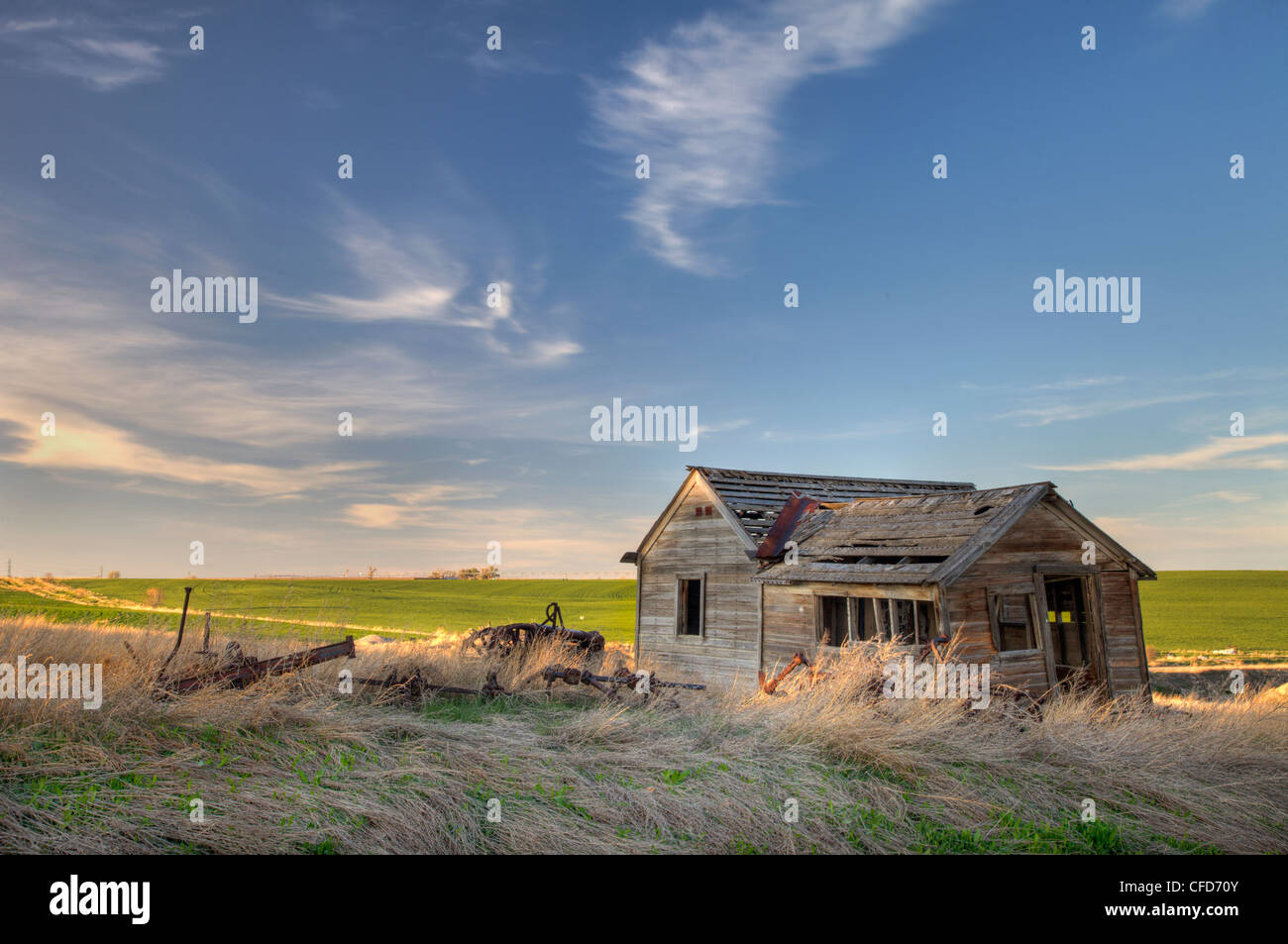 old abandoned house and farming machinery on Colorado prairie with ...
