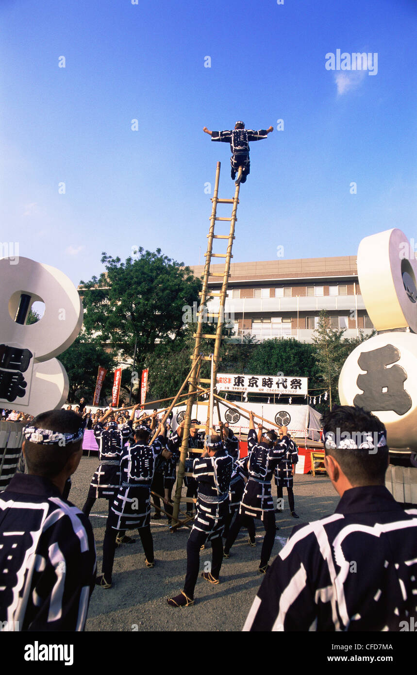 Japan, Tokyo, Acrobatic Display by Firemen at Jidai Matsuri Festival at ...