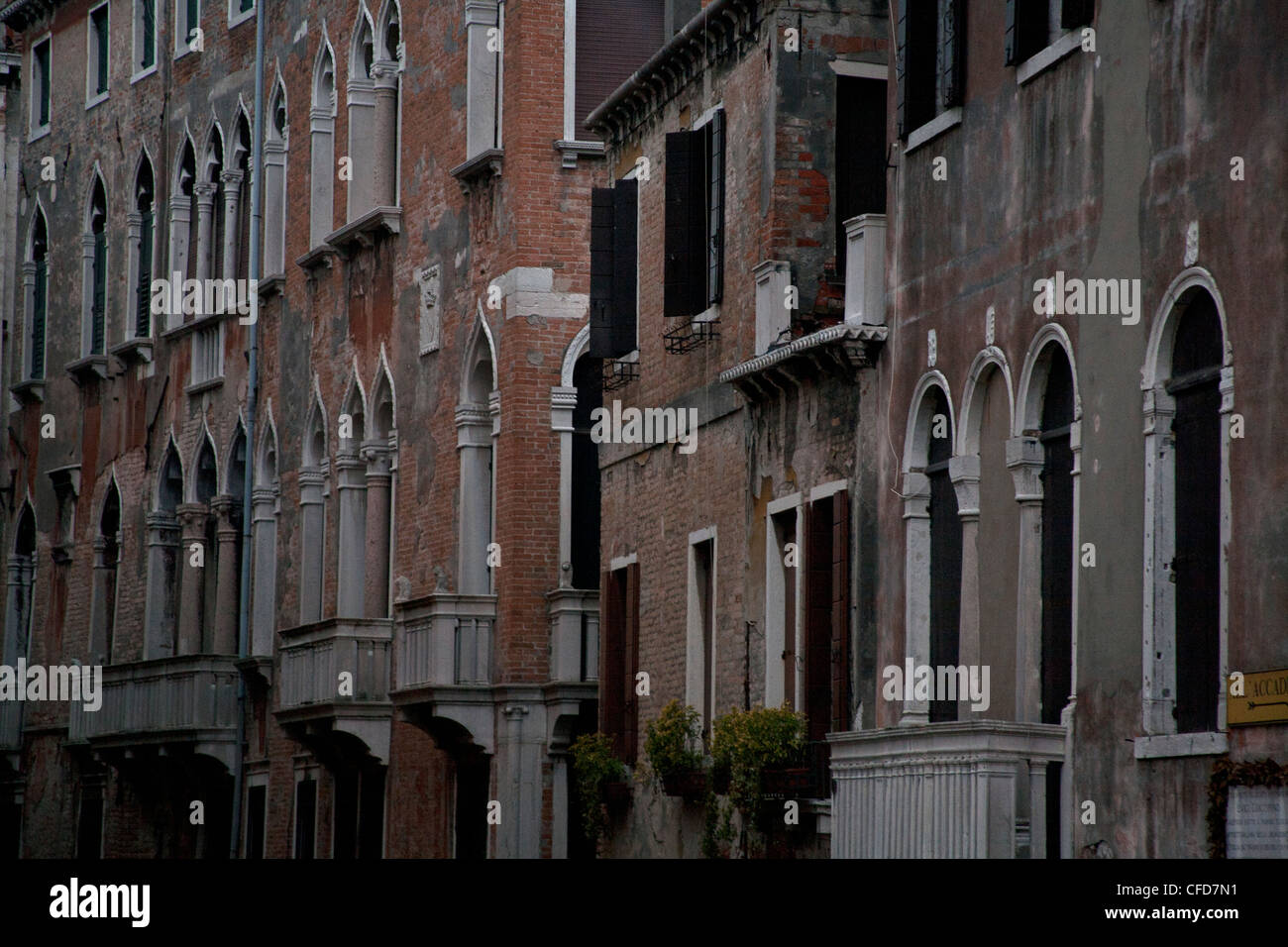 Row of Venetian buildings with arched and shuttered windows, Venice ...