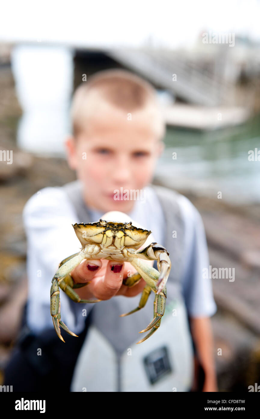 a boy holds his catch up for a photo Stock Photo - Alamy