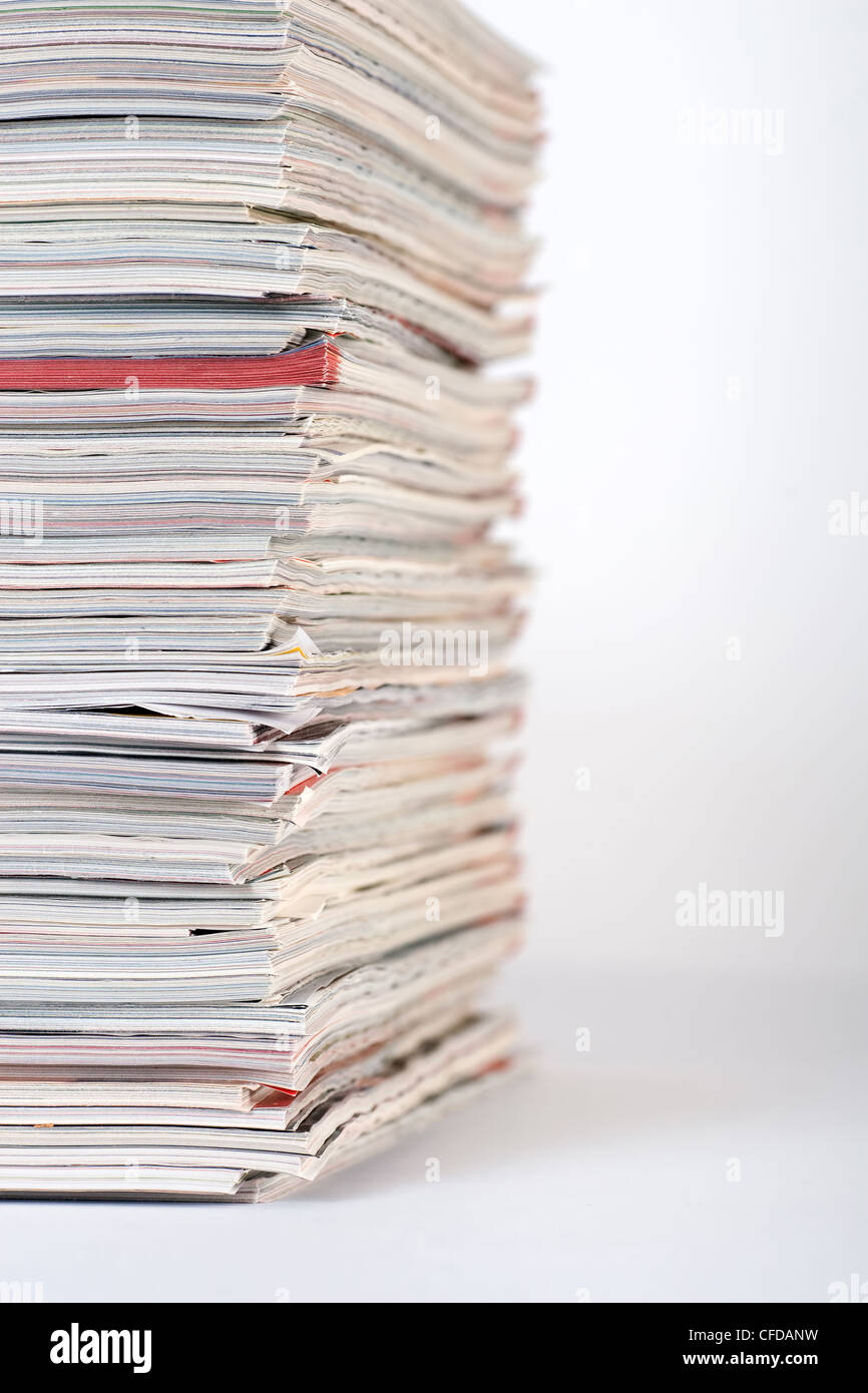 High pile of color magazines Stock Photo - Alamy