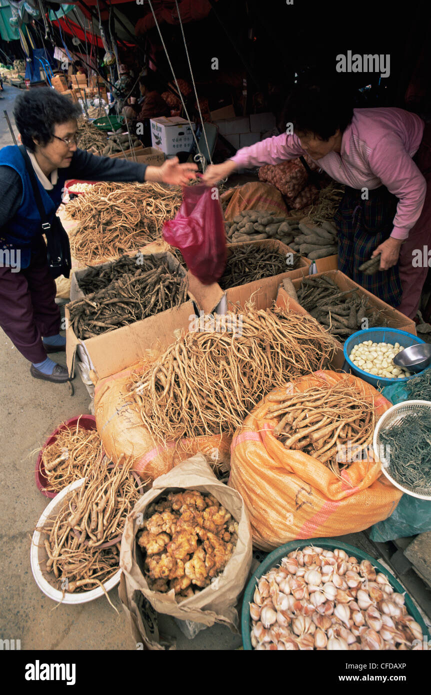 Korea, Seoul, Namdaemun Market, Woman Buying Ginseng in Ginseng and ...