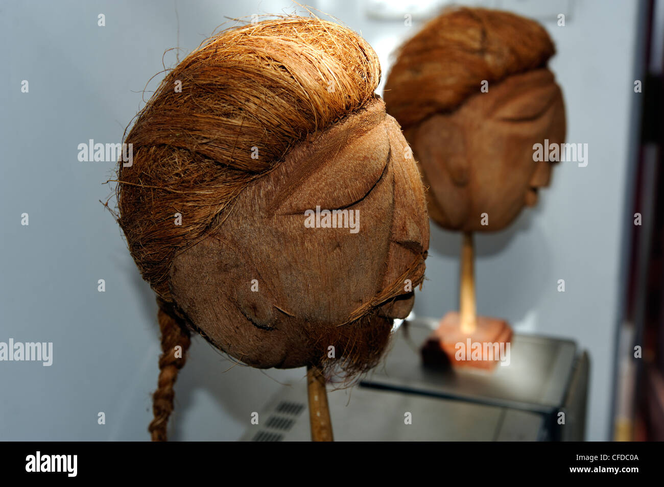Heads carved from coconuts Stock Photo - Alamy