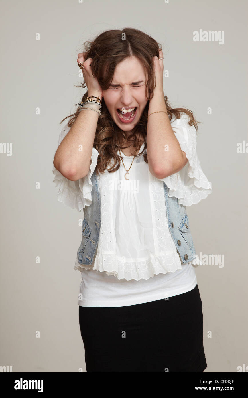 teenager girls screaming Stock Photo - Alamy