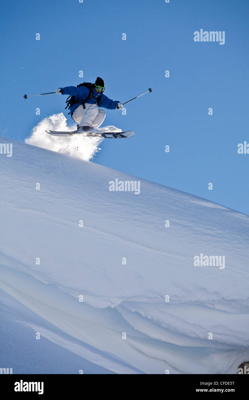 A young male skier catching air off a cornice, Healy Pass, Sunshine ...