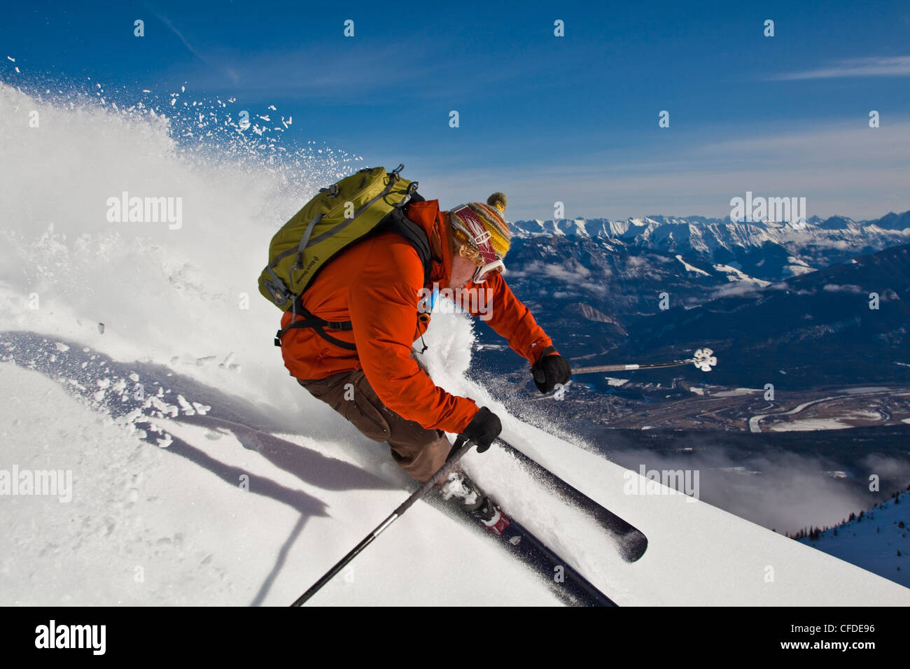 A young man sprays a powder turn. Kicking Horse Backcountry, Golden ...