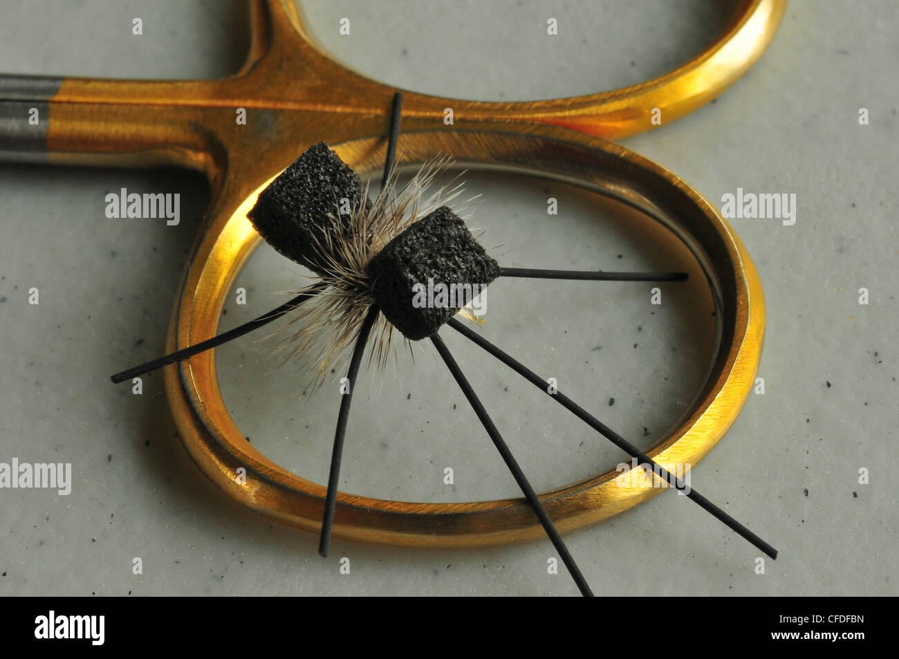 Foam spider fly and scissor handles Stock Photo - Alamy