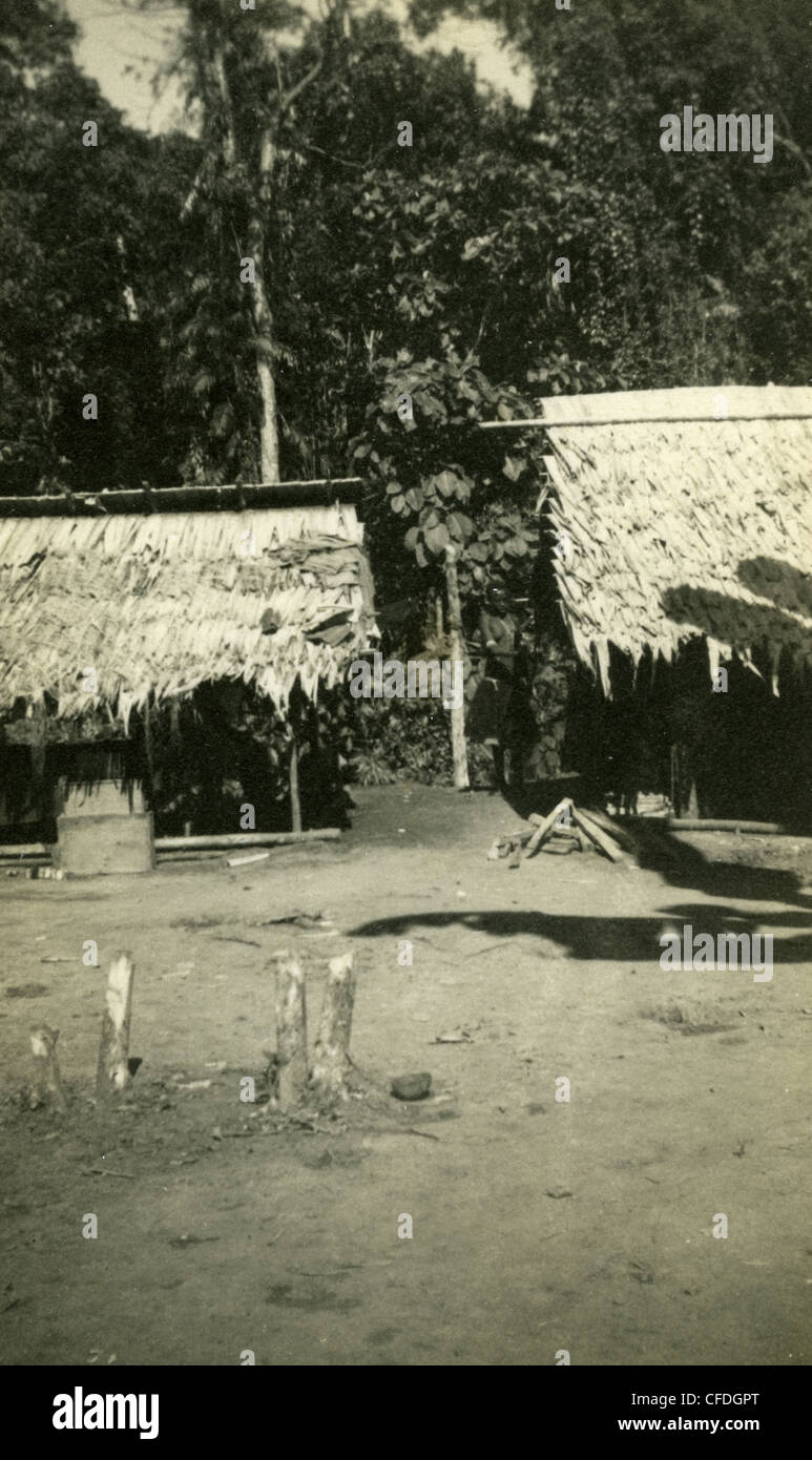 Thatched roof huts in village on South Pacific Island during WWII ...
