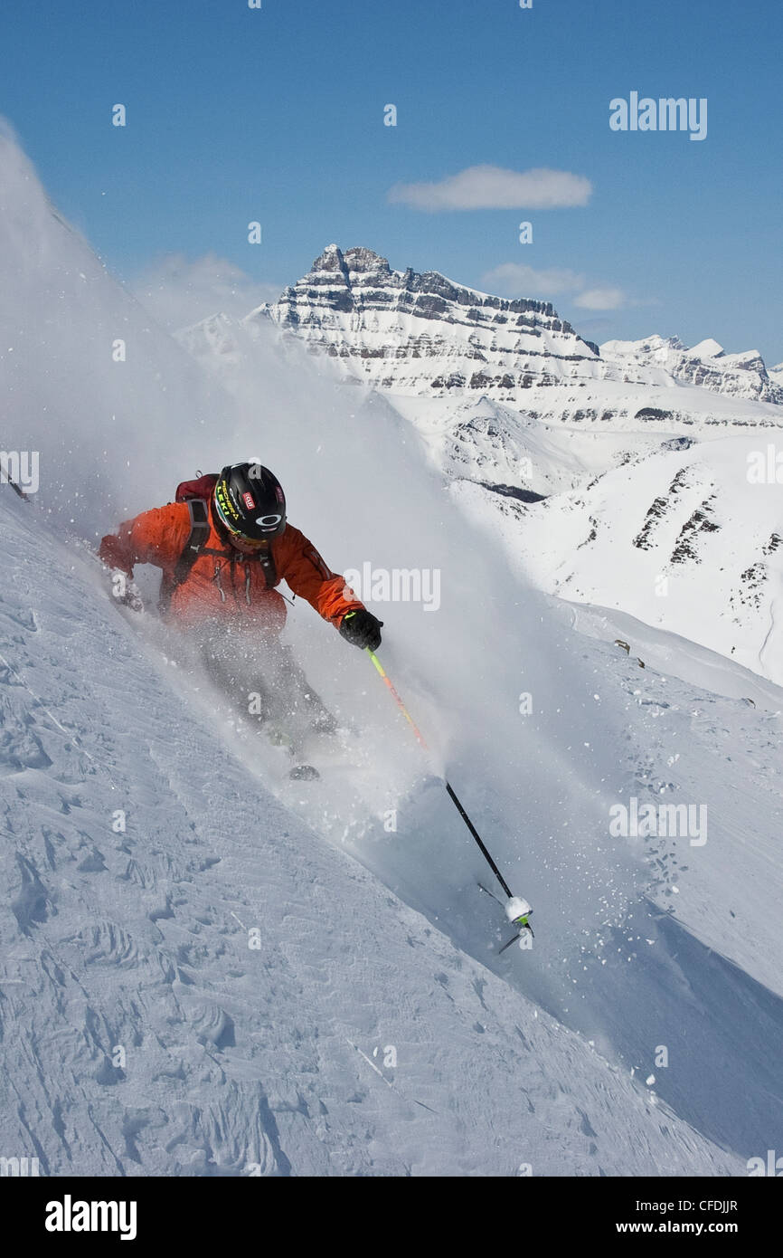 Young man skiing powder at Lake Louise Ski Area, Banff National Park ...