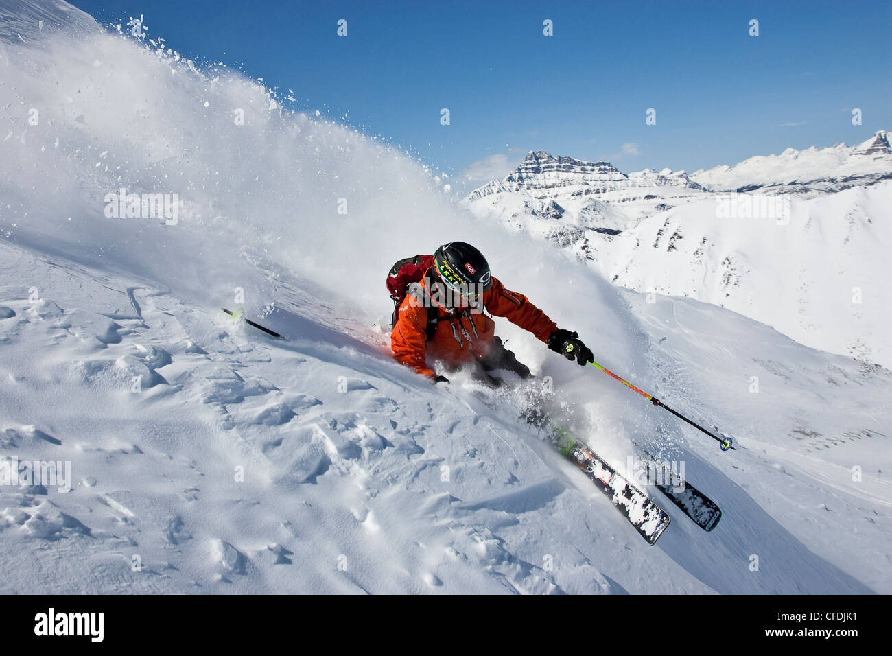 Young man skiing powder at Lake Louise Ski Area, Banff National Park ...