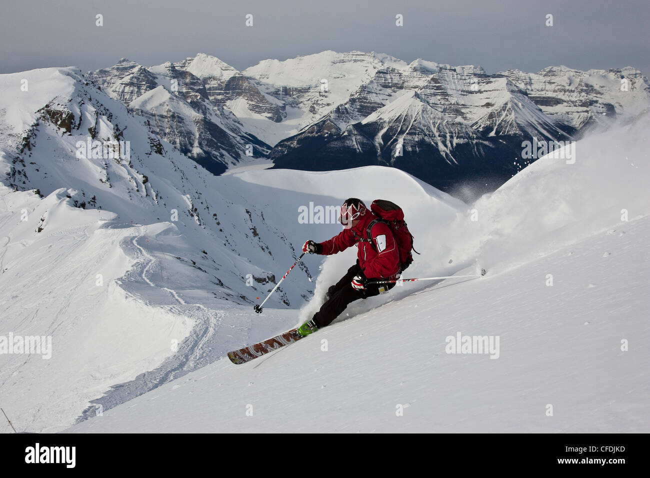 Young man skiing powder at Lake Louise Ski Area, Banff National Park ...