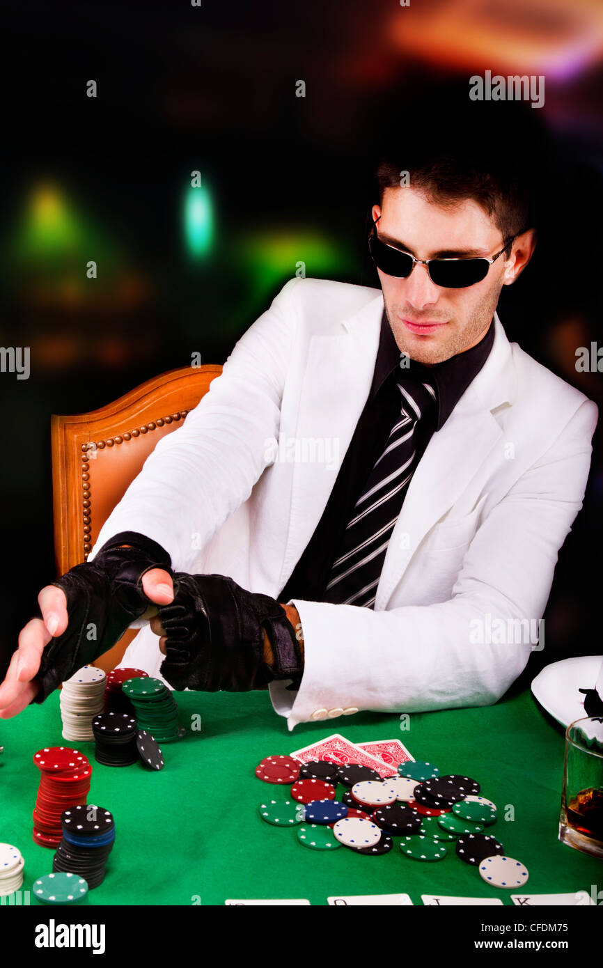View of a gangster man playing some cards and poker Stock Photo - Alamy