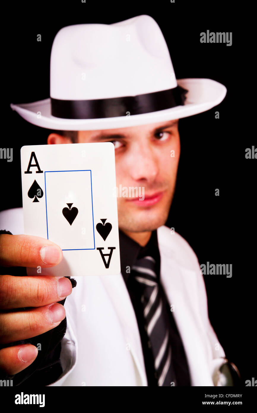 View of a white suit man with hat holding an ace card Stock Photo - Alamy