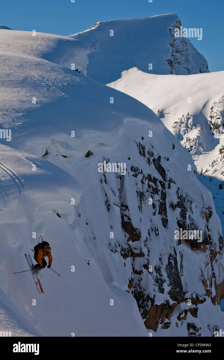 A male skier drops off a cornice in the, Kicking Horse Backcountry ...