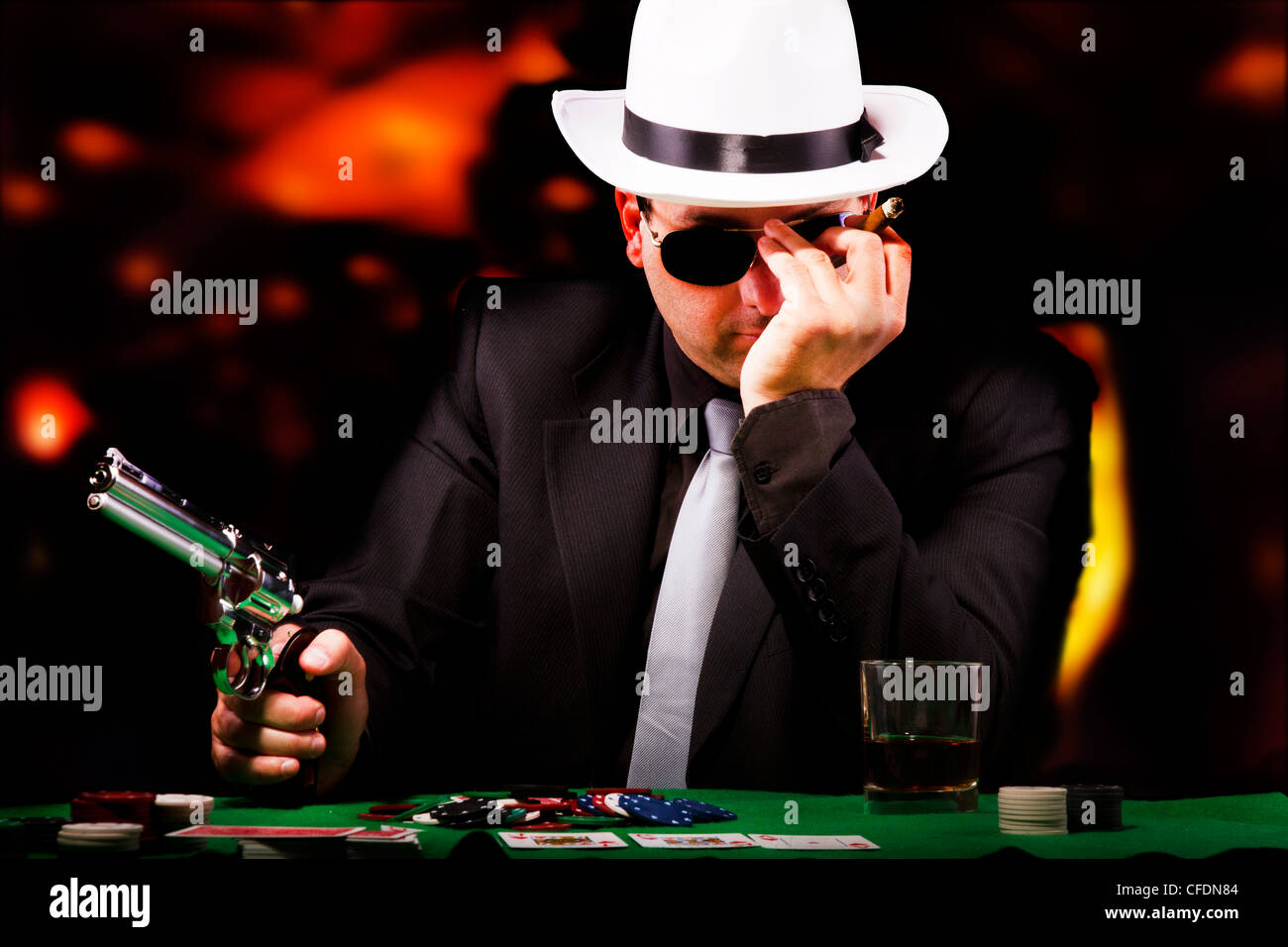 Man gun poker table hi-res stock photography and images - Alamy