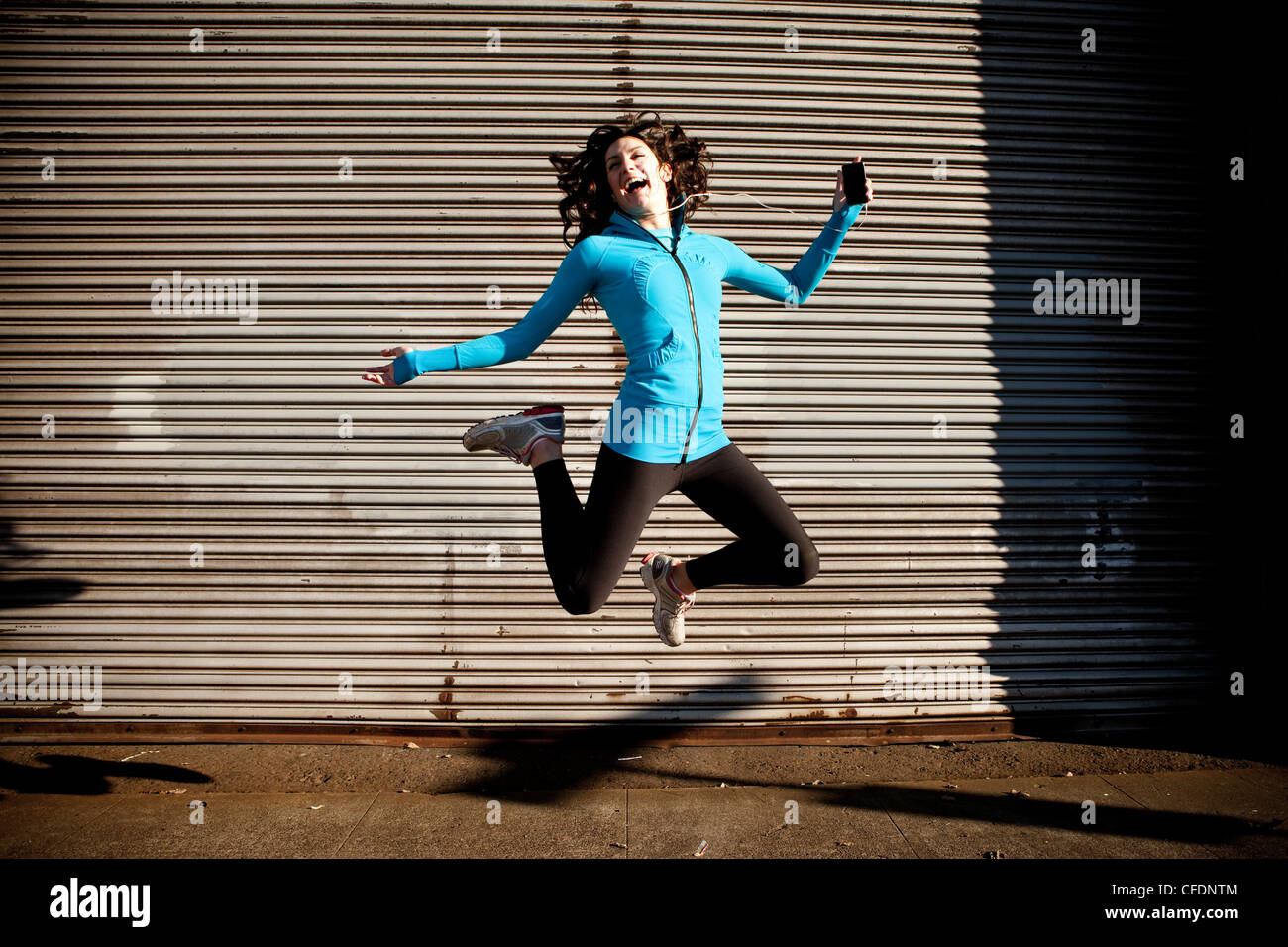 A woman rocking out to her music Stock Photo - Alamy