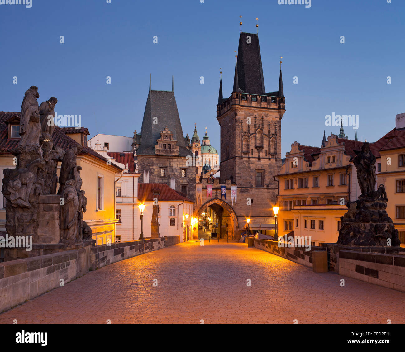 Charles bridge and city gate in the evening, Prague, Czechia, Europe ...