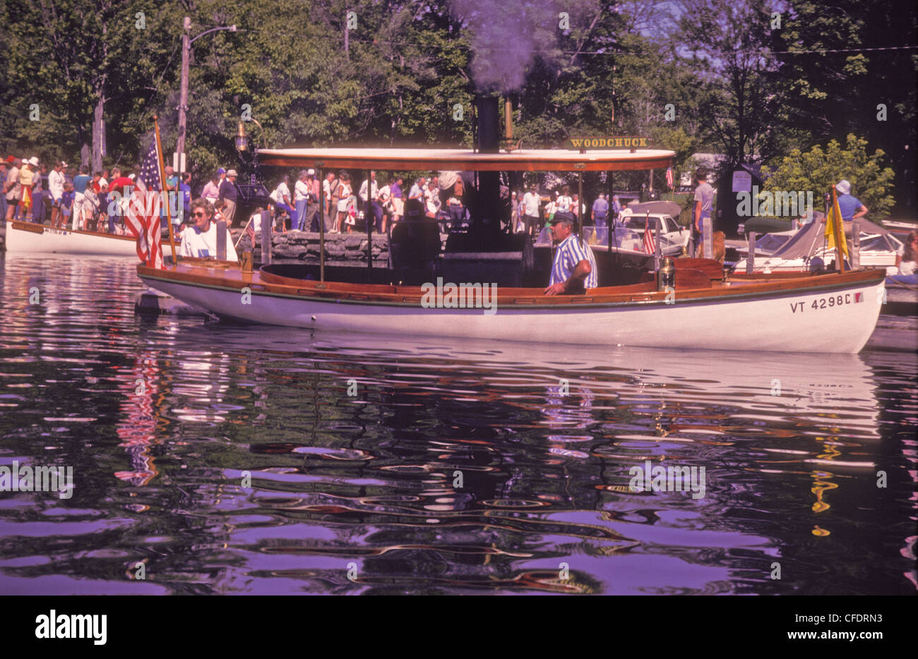 Water, boating activity during 4th of July antique boat parade on Lake ...