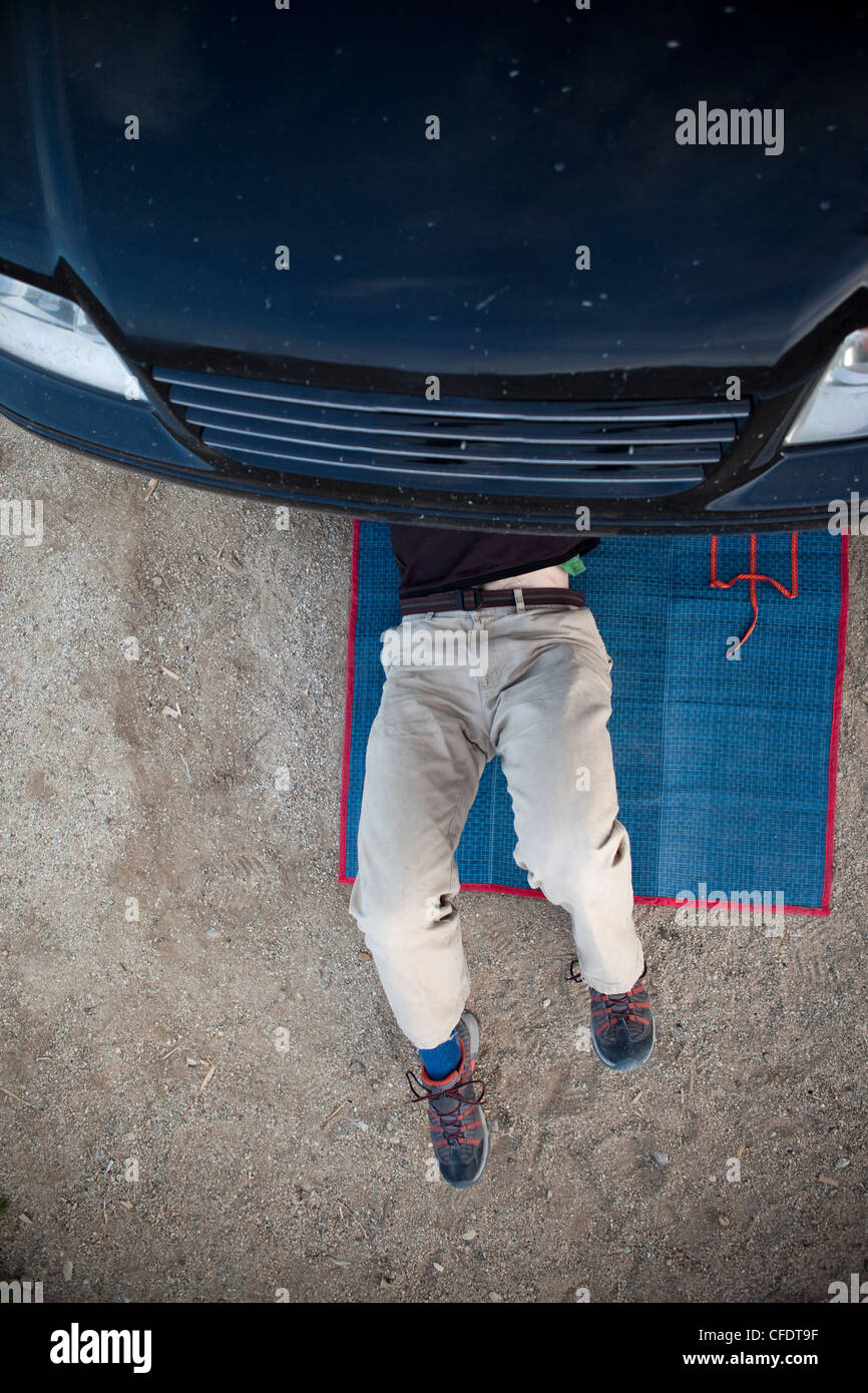 Man fixing a car Stock Photo - Alamy