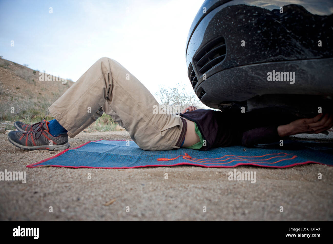 Man fixing a car Stock Photo - Alamy