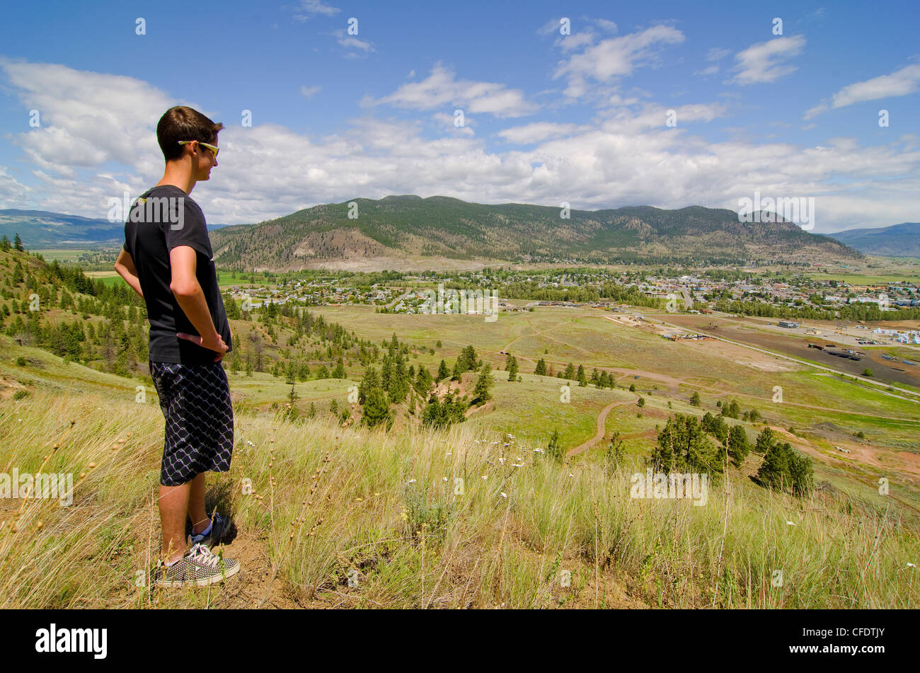 Male youth enjoys the views of Merritt from Windy Canyon, Merritt ...