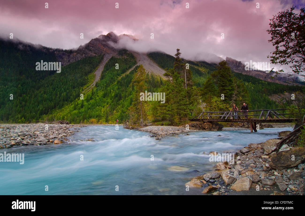 Hikers stop along bridge enjoy scene along Robson Stock Photo - Alamy