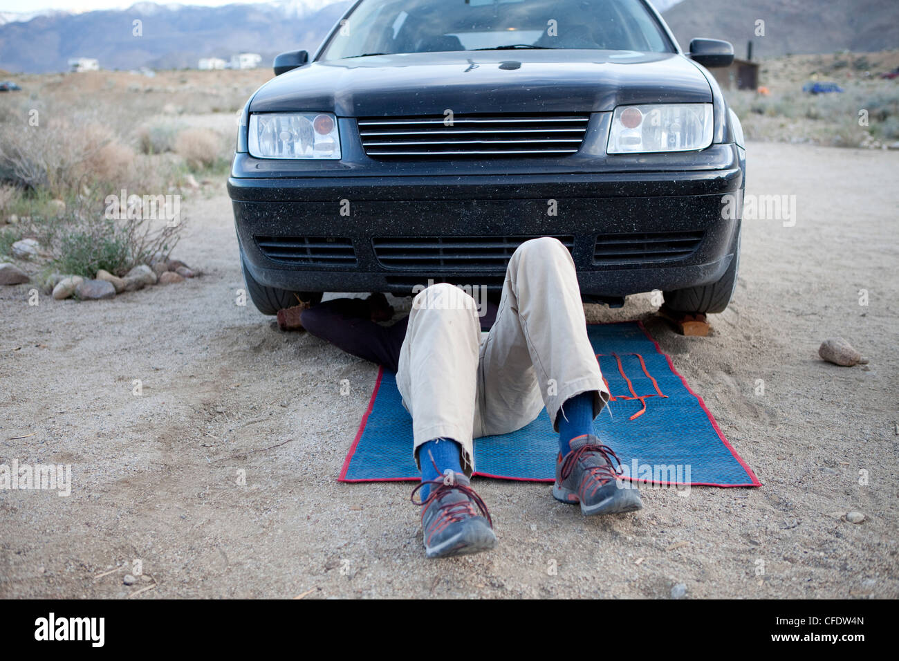 Man fixing a car Stock Photo - Alamy