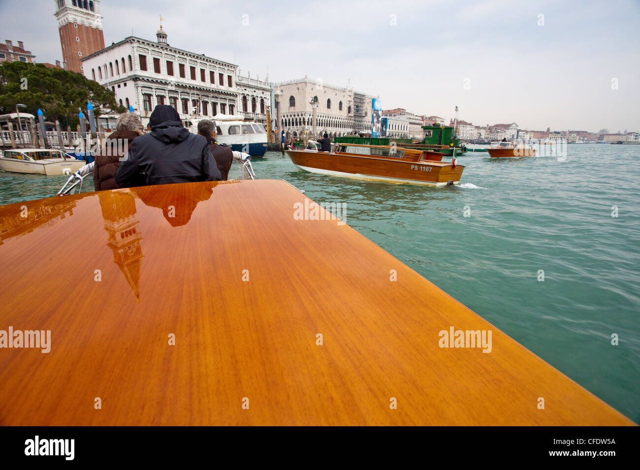 Traditional wood construction tourist boats on Grand Canal, Venice ...
