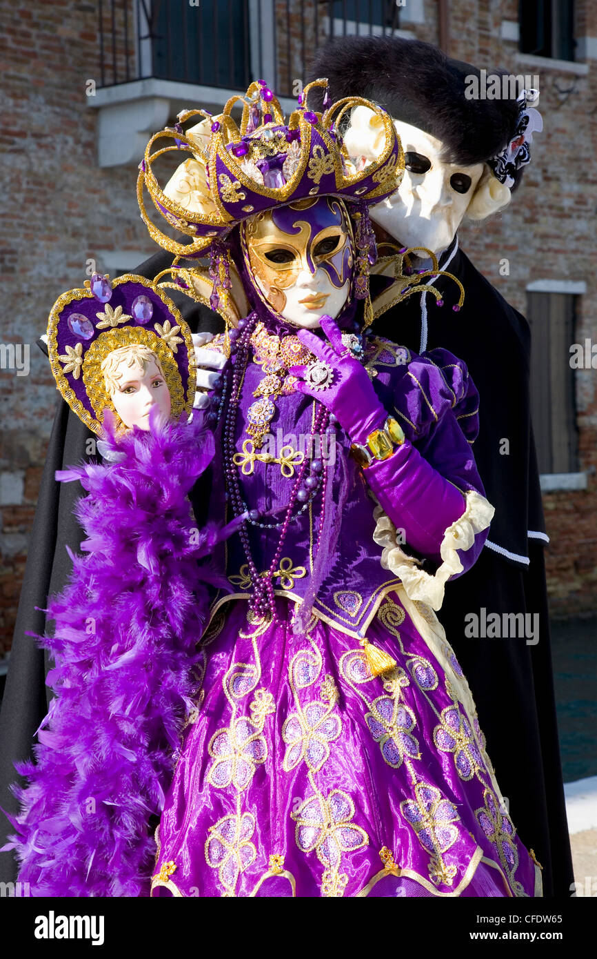 Masked carnival characters in costume, Campo della Salute, Dorsoduro district, Venice, Veneto ...