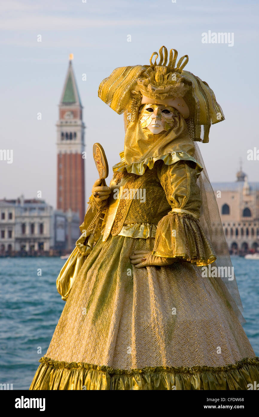Masked carnival character in costume, Campo San Giorgio, Island of San Giorgio Maggiore, Venice ...