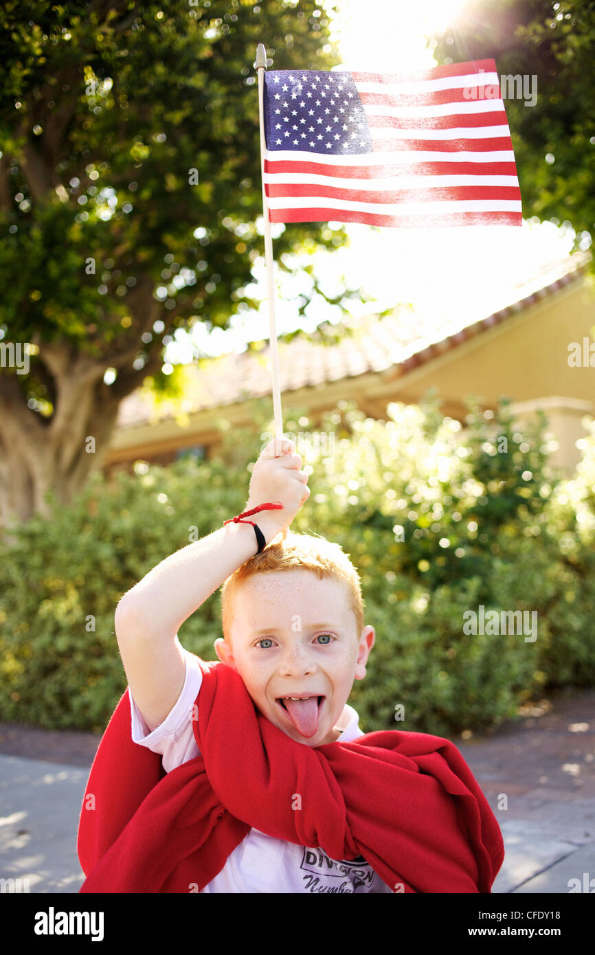 Patriotic Boy with American Flag Stock Photo - Alamy