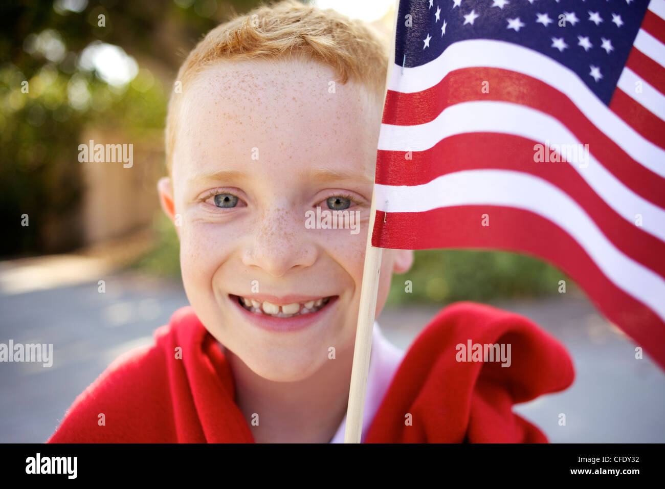 Patriotic Boy with American Flag Stock Photo - Alamy
