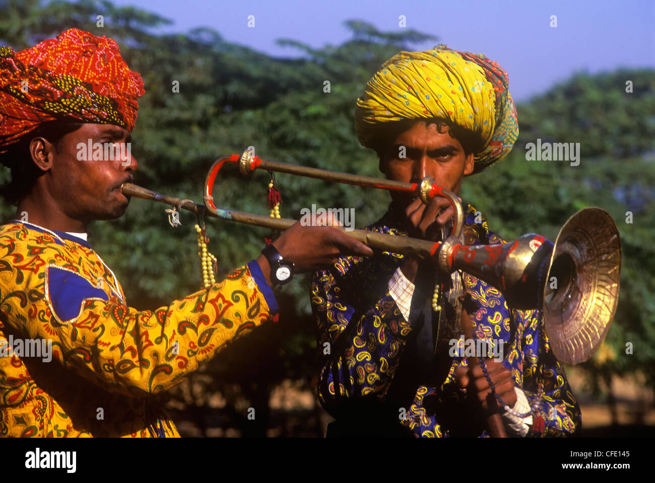 Indian man playing trumpet hi-res stock photography and images - Alamy