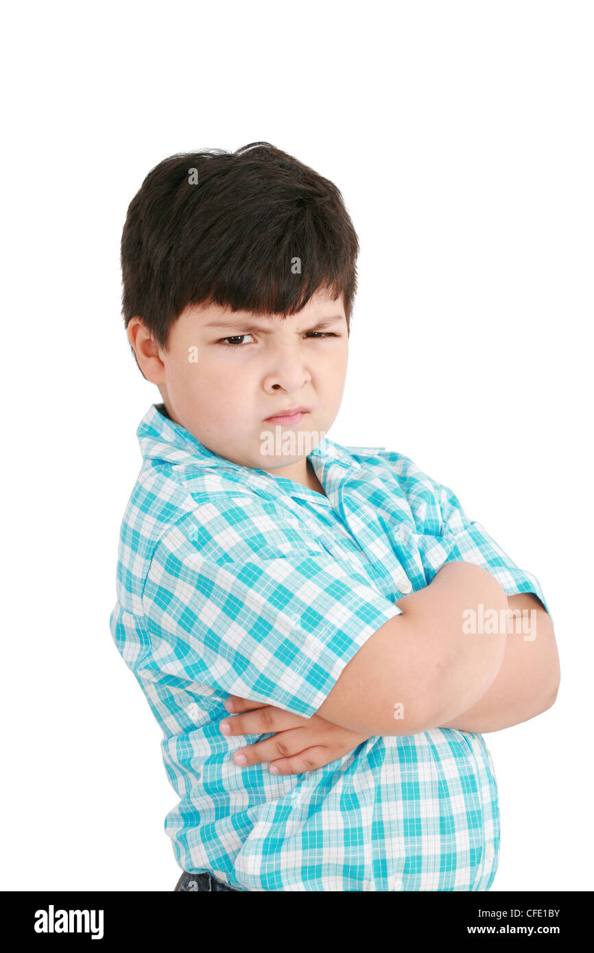 serious little boy with hands folded standing isolated on white ...